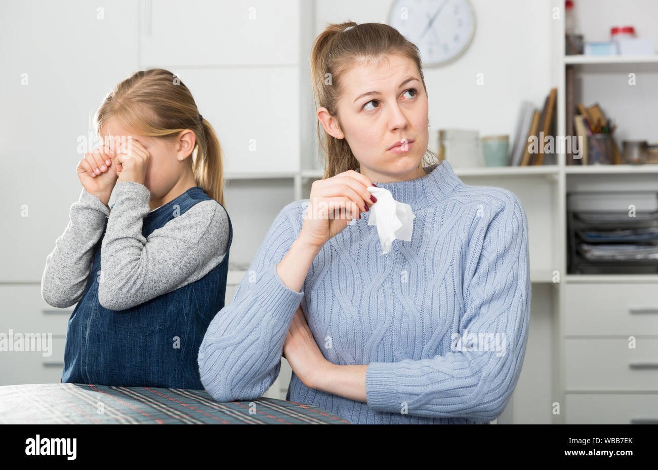 Portrait of crying mother and her teenage daughter at home Stock Photo ...
