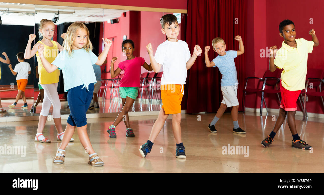 Portrait of group of cheerful little boys and beautiful girls having ...