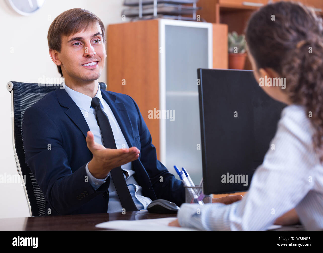Potential employee having job interview with successful manager Stock ...