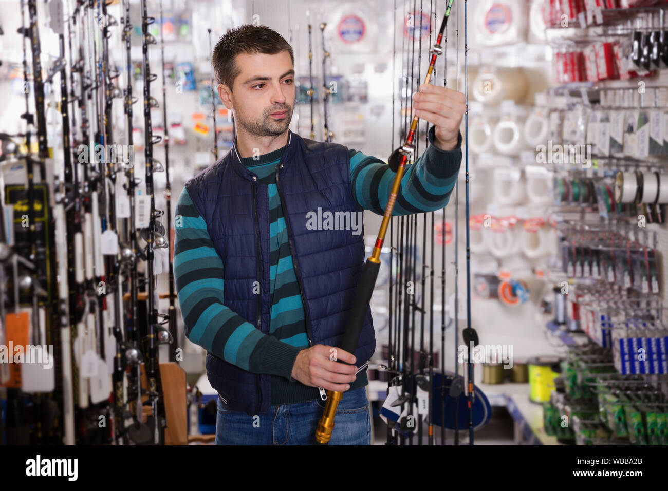 Young shopper choosing fishing hi-res stock photography and images - Alamy