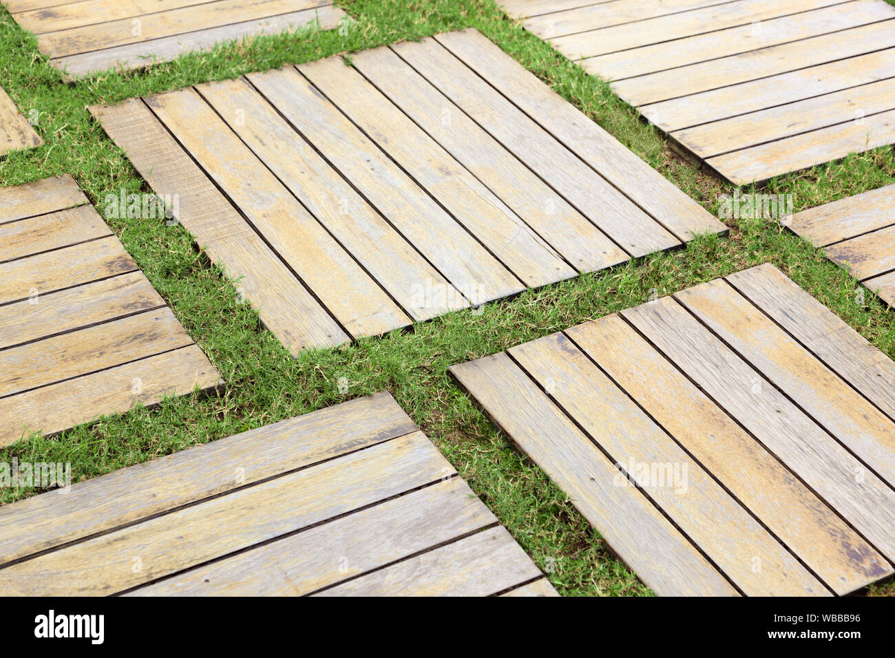 Wooden floor ,outdoors background, small rectangular blocks of wood and ...