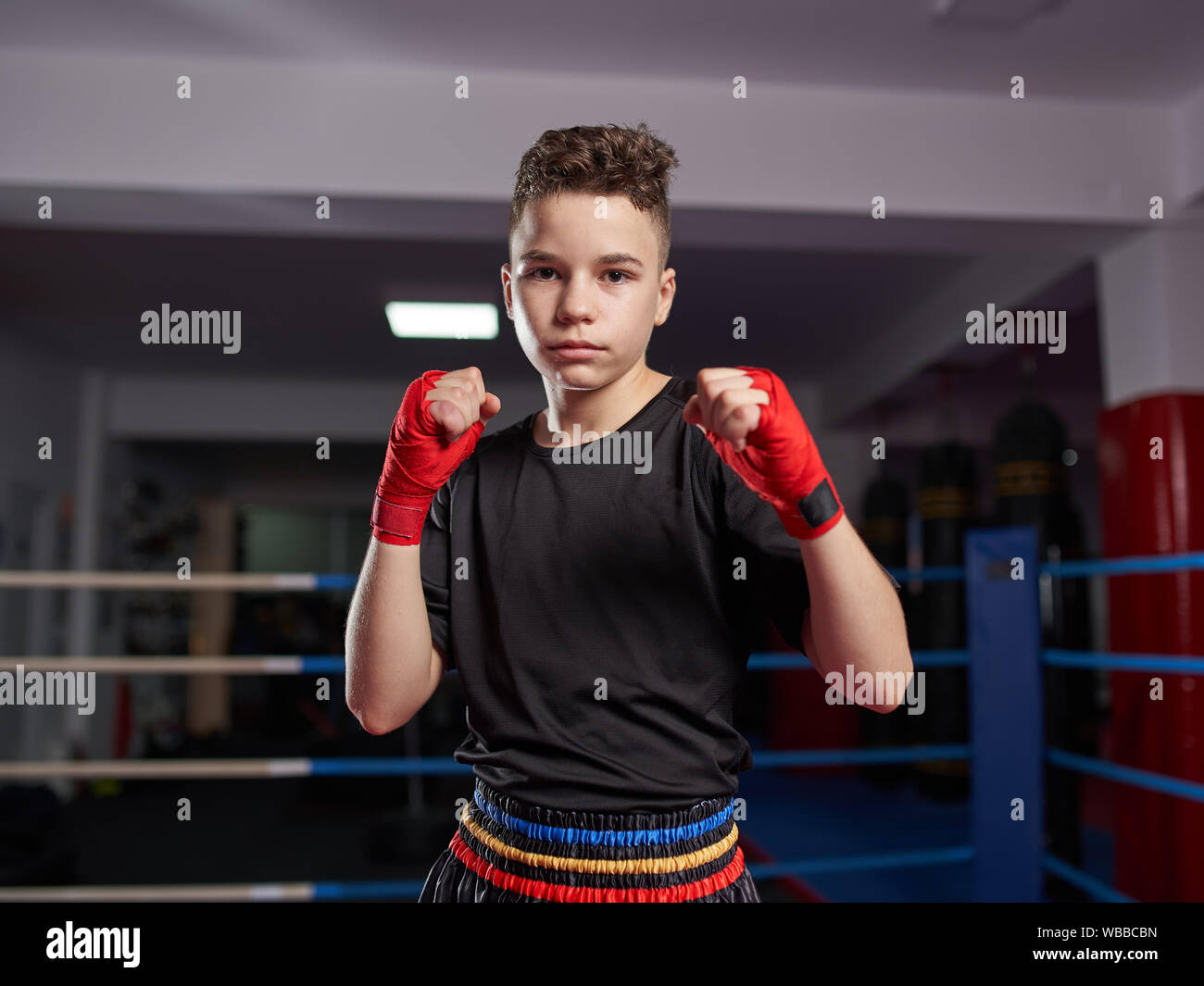 Young fighter with hands wrapped shadow boxing in the ring Stock Photo ...