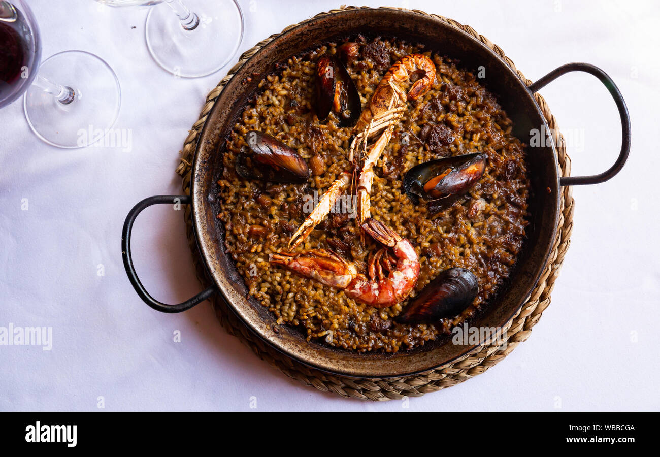 Top view of Valencian paella marinera with mussels and shrimps served ...