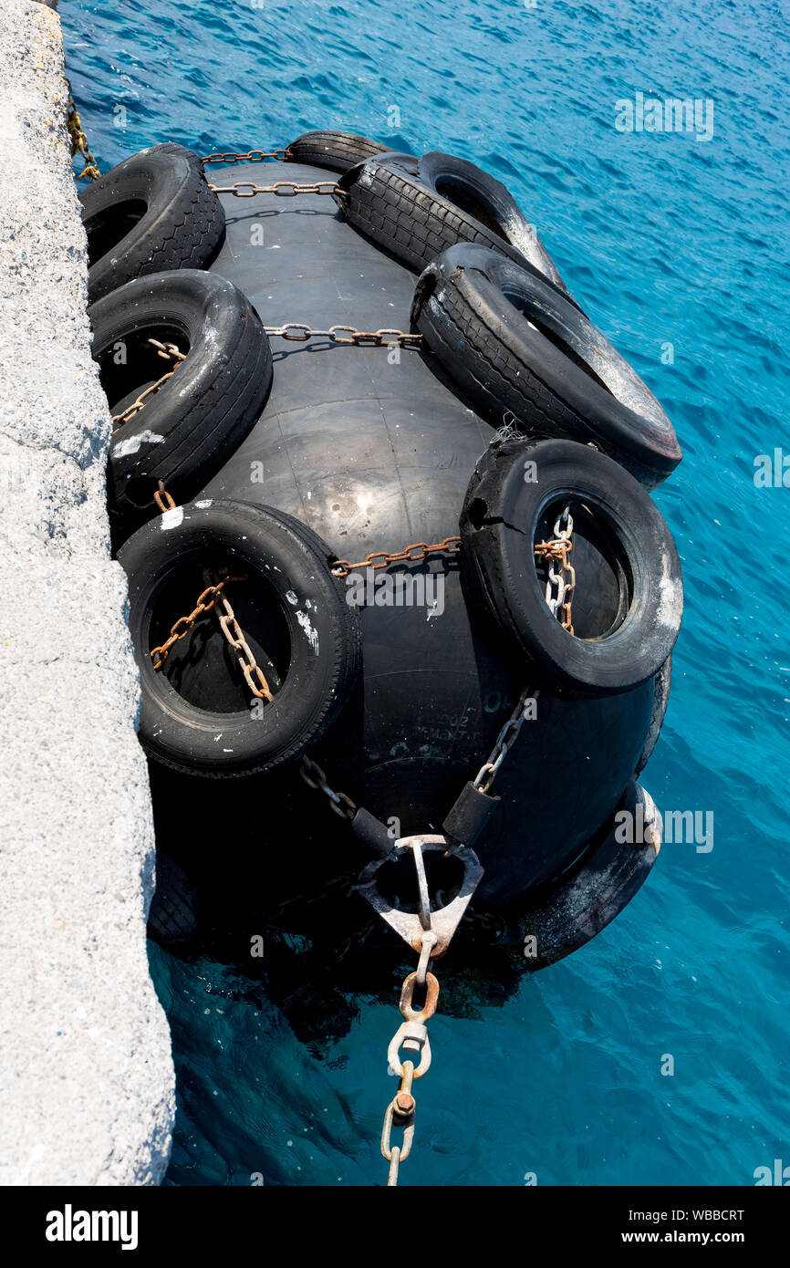 Ship fenders yokohamas, at the quayside at Agios Nikolaos Greece Stock ...