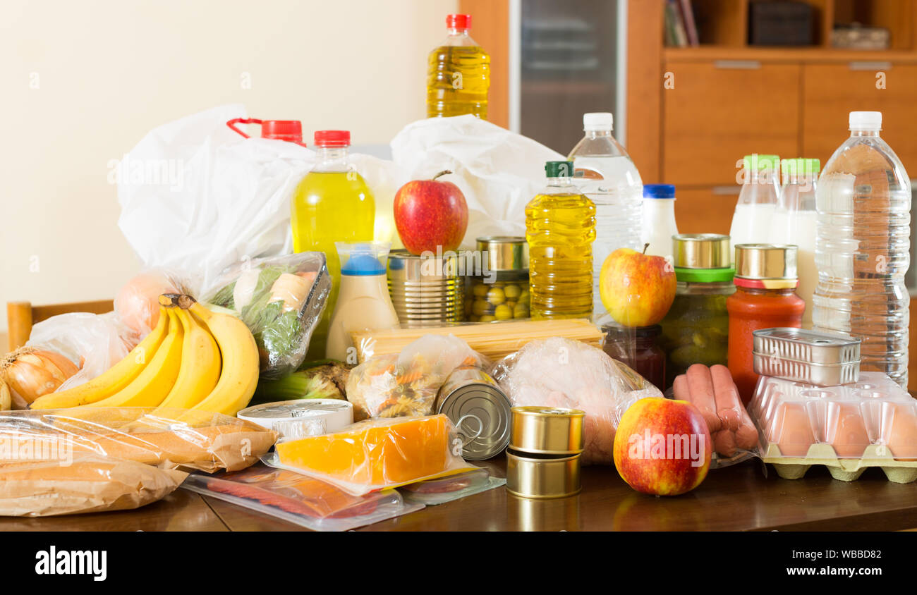 purchases from supermarket on table in home interior Stock Photo - Alamy