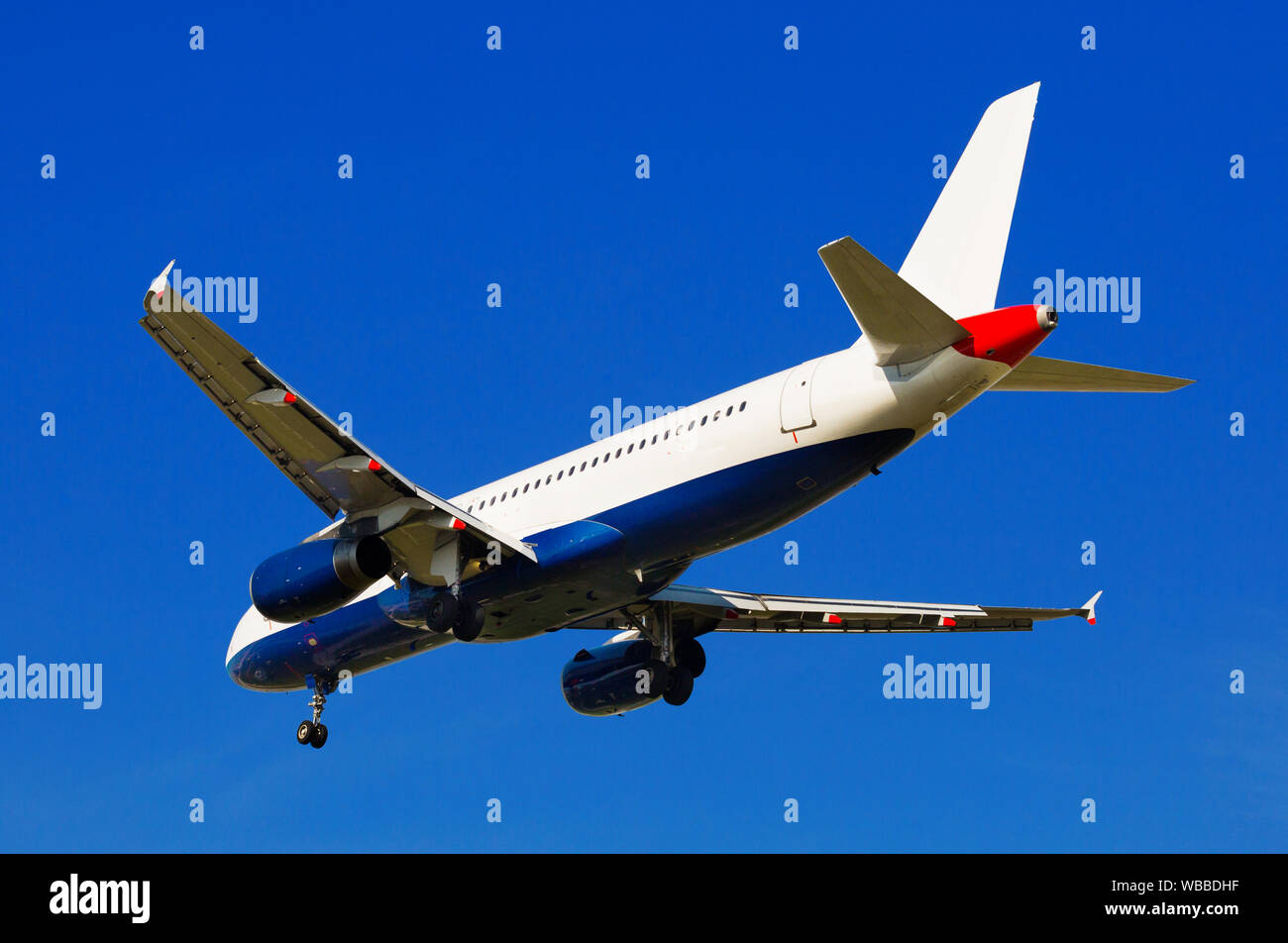 passenger airliner flying in sky towards destination Stock Photo - Alamy