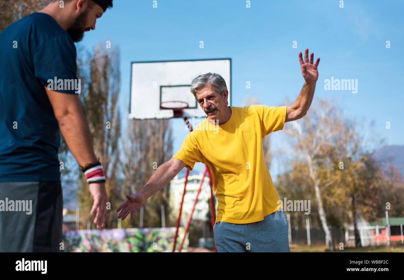 Two guys playing basketball hi-res stock photography and images - Alamy
