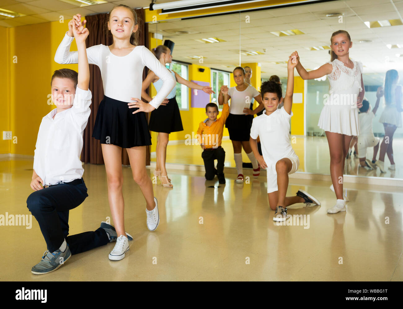 Happy children studying of partner dance at dance school Stock Photo ...
