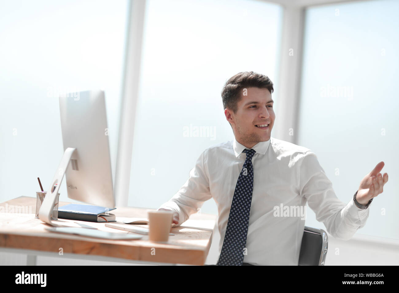 young employee in the workplace in the office Stock Photo - Alamy