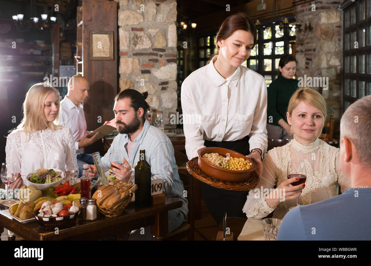 Polite waitress bringing ordered hi-res stock photography and images ...