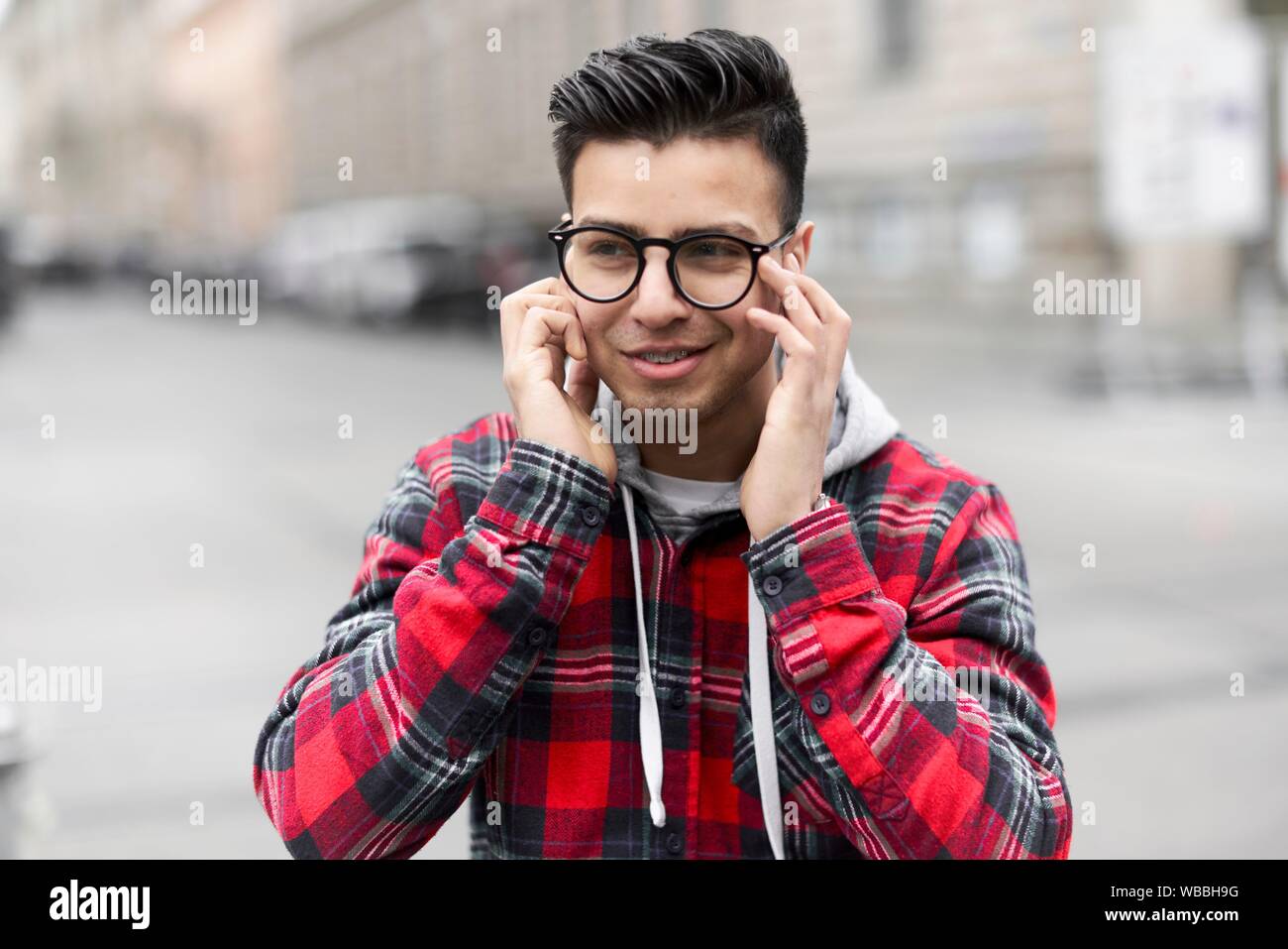 Man wearing red hooded shirt hi-res stock photography and images - Alamy