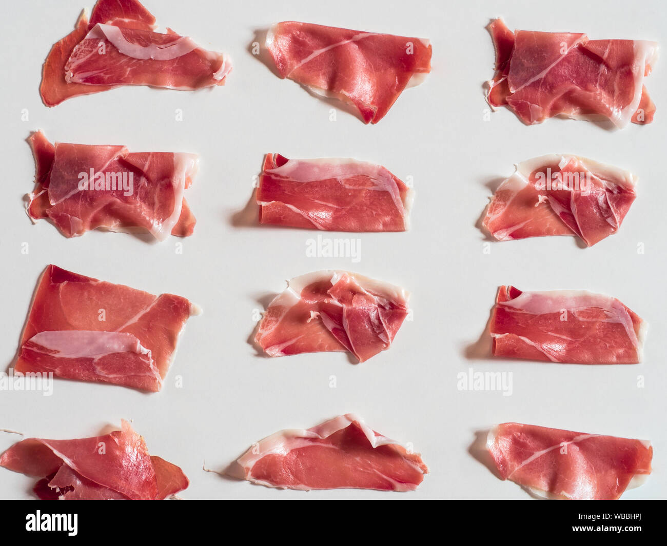 Serrano ham pattern on white background Stock Photo - Alamy