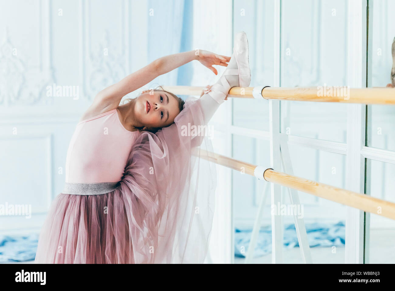 Young classical ballet dancer girl in dance class. Beautiful graceful ...