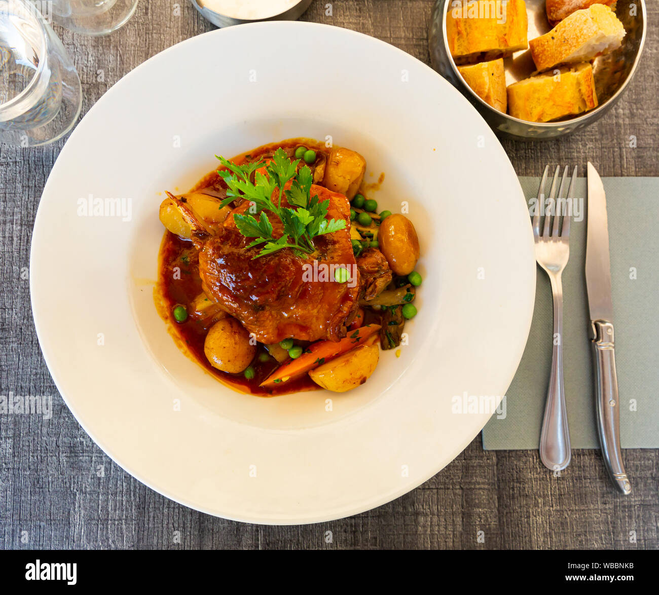 French cuisine, braised duck leg served with stewed vegetables Stock ...