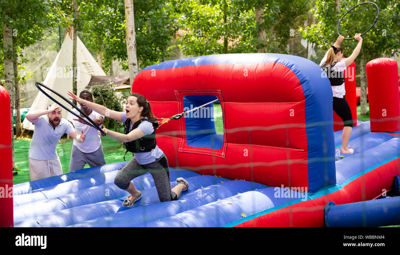 Competition of two women - who quickly throw a hoop on a stick Stock ...