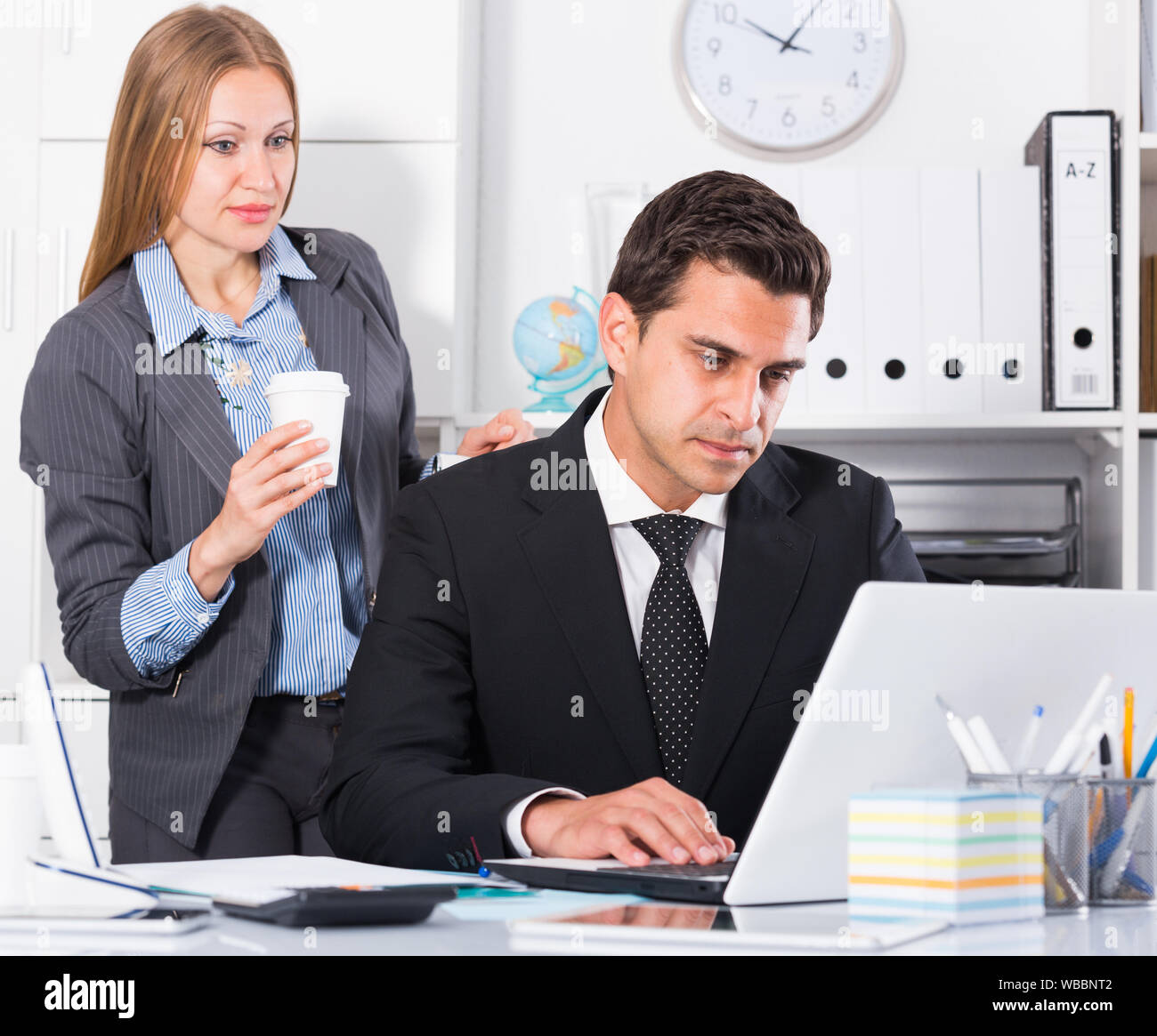 Two successful business partners working at meeting in office Stock ...