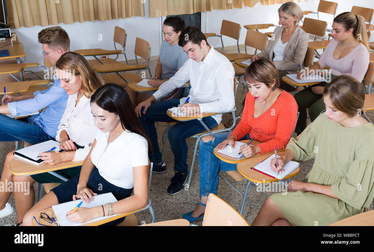Portrait of group of different age people in lecture hall at extension ...