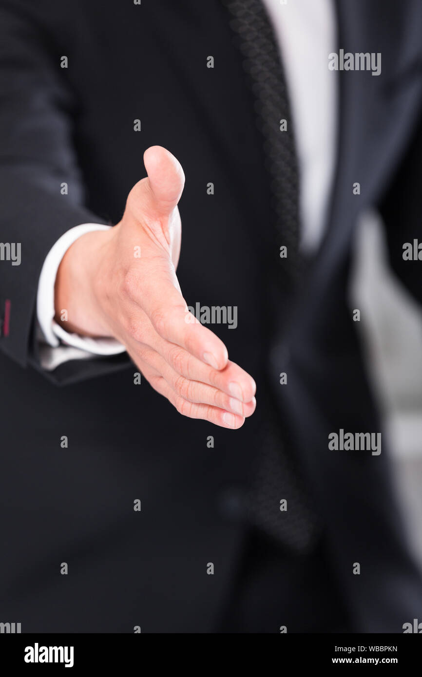 Businessmen ready to handshake offering successful business partnership ...