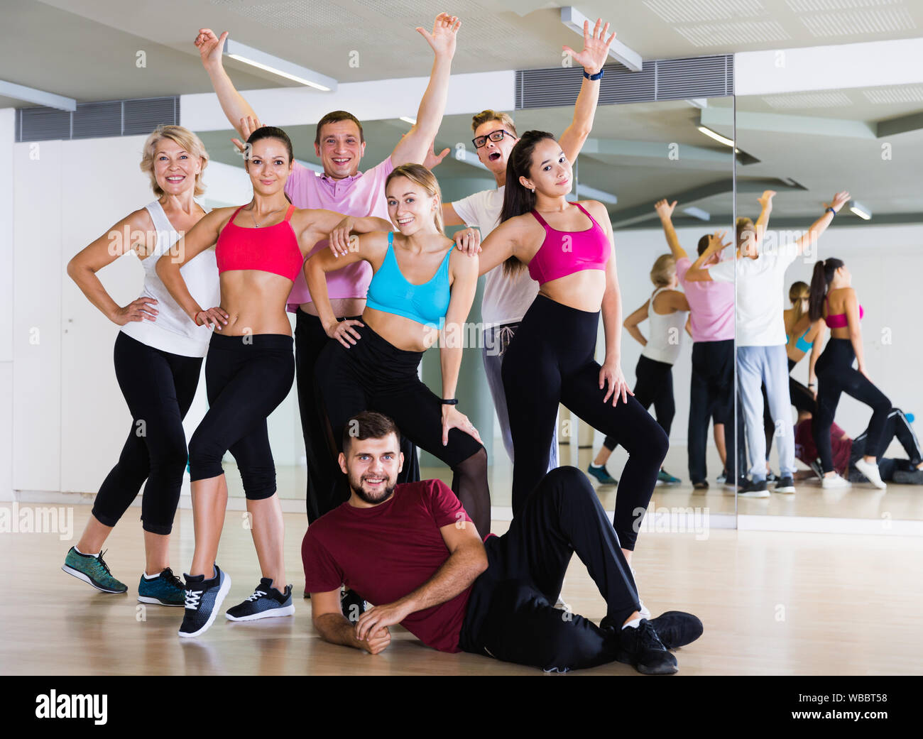 Adult males and females dancing excited posing in studio Stock Photo ...