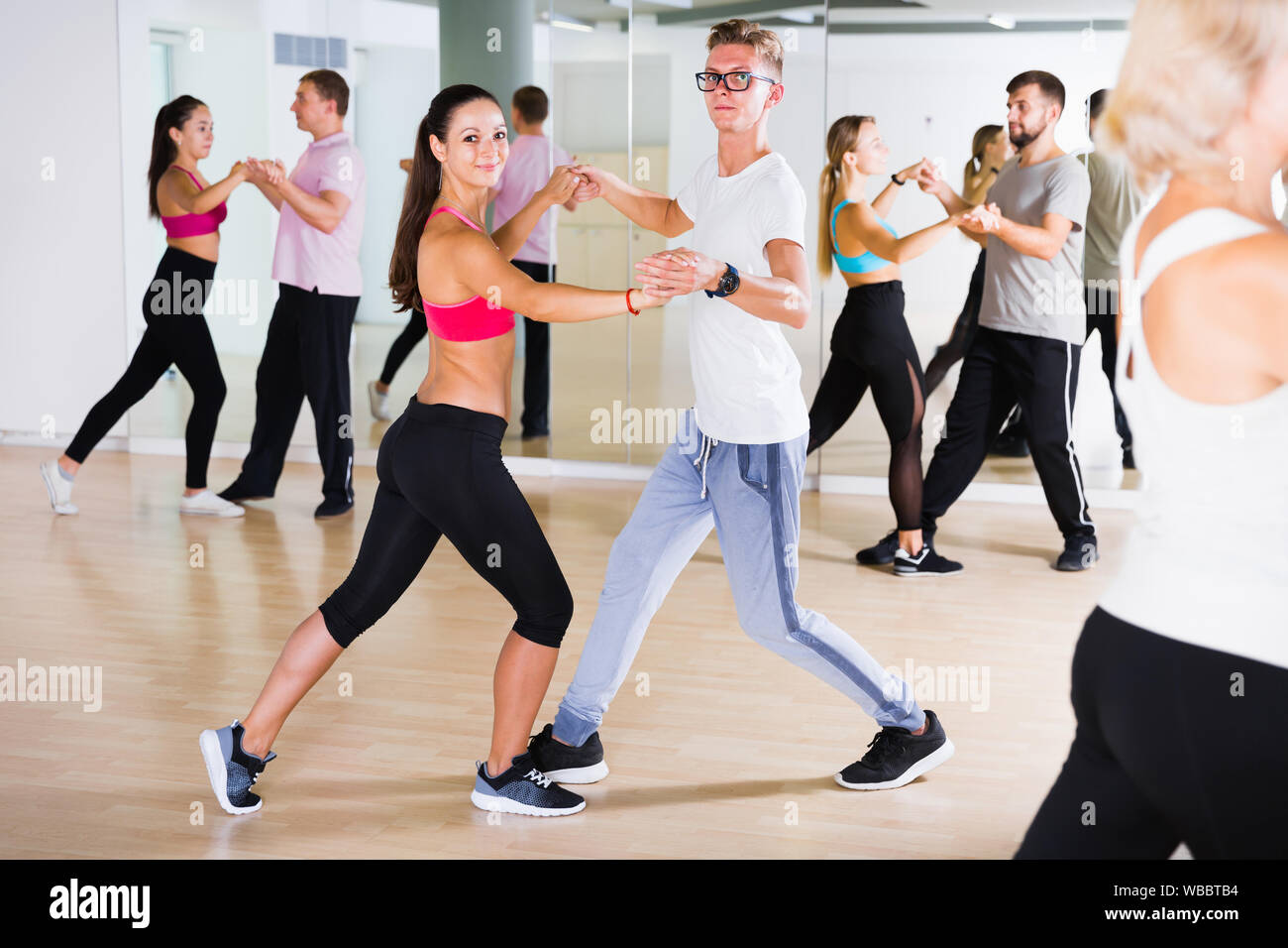 Young dancing pair dance tango together in studio Stock Photo - Alamy