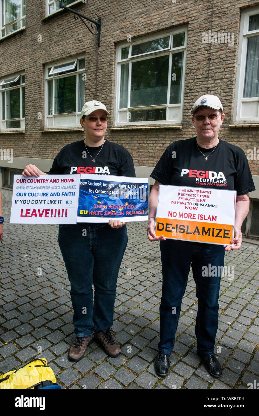 Breda, Netherlands. Male & Female Pegida supporter with sign protesting ...