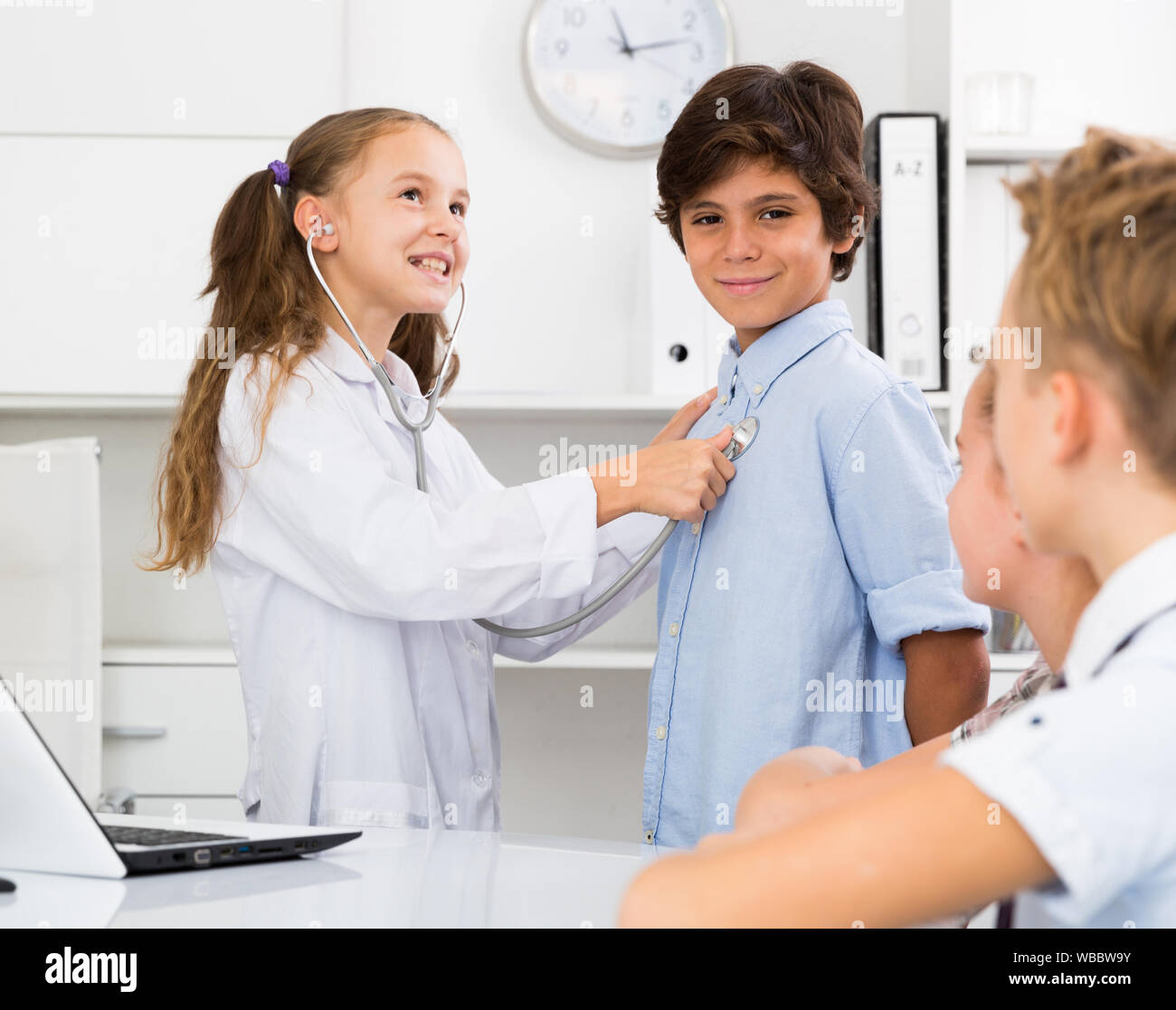 Young female doctor in uniform leading medical appointment with ...