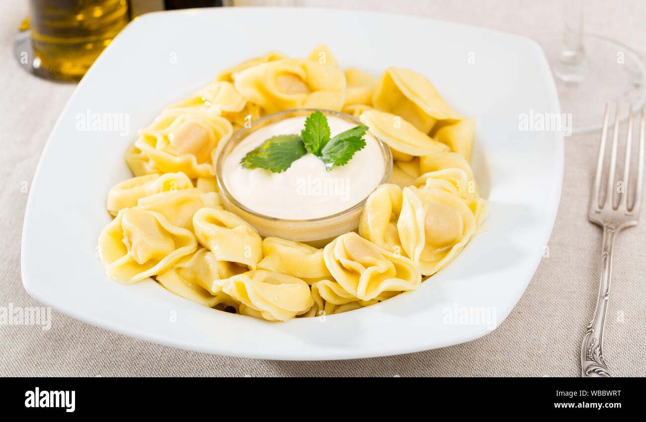 Boiled ravioli with mayonnaise Stock Photo - Alamy