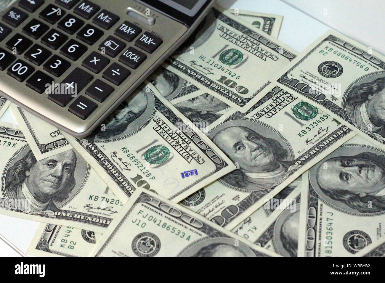 Cash of hundred dollar bills. A pile of one hundred US banknotes .100 ...