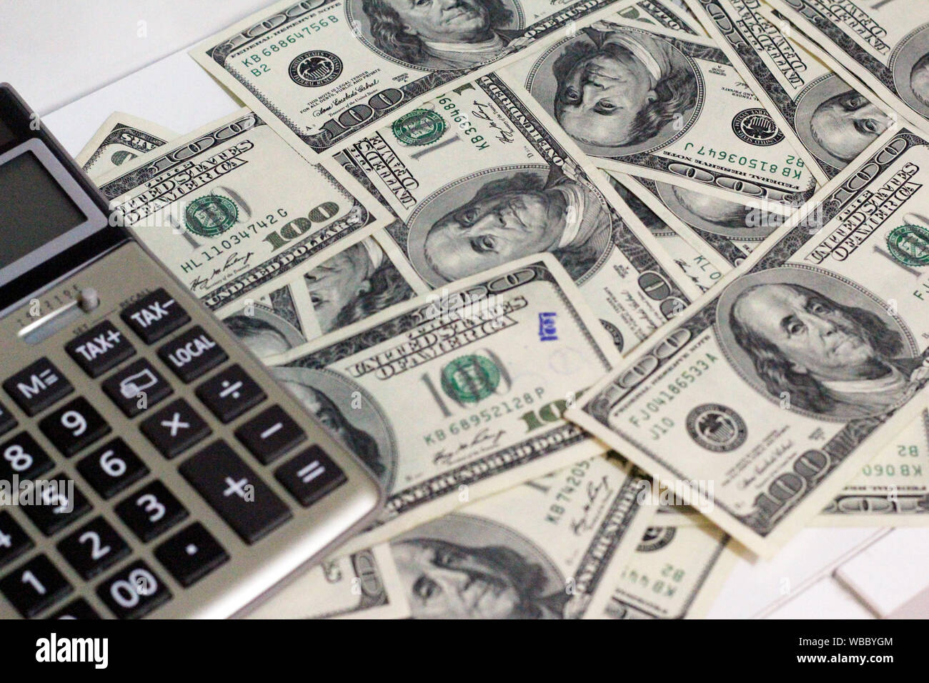 Cash of hundred dollar bills. A pile of one hundred US banknotes .100 ...