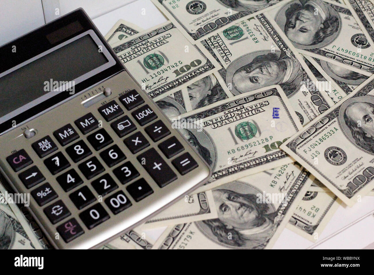 Cash of hundred dollar bills. A pile of one hundred US banknotes .100 ...