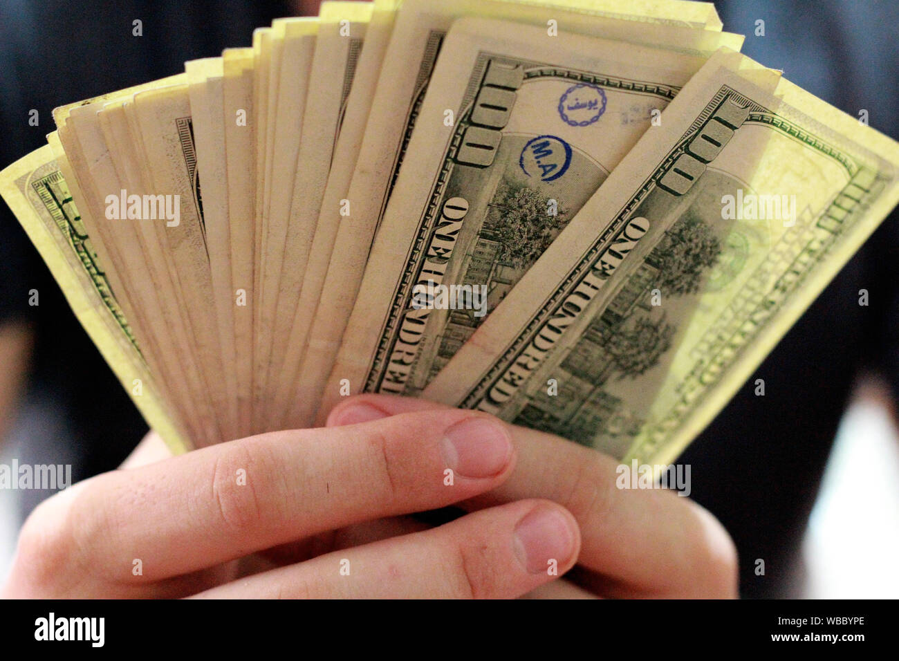 Cash of hundred dollar bills. A pile of one hundred US banknotes .100 ...