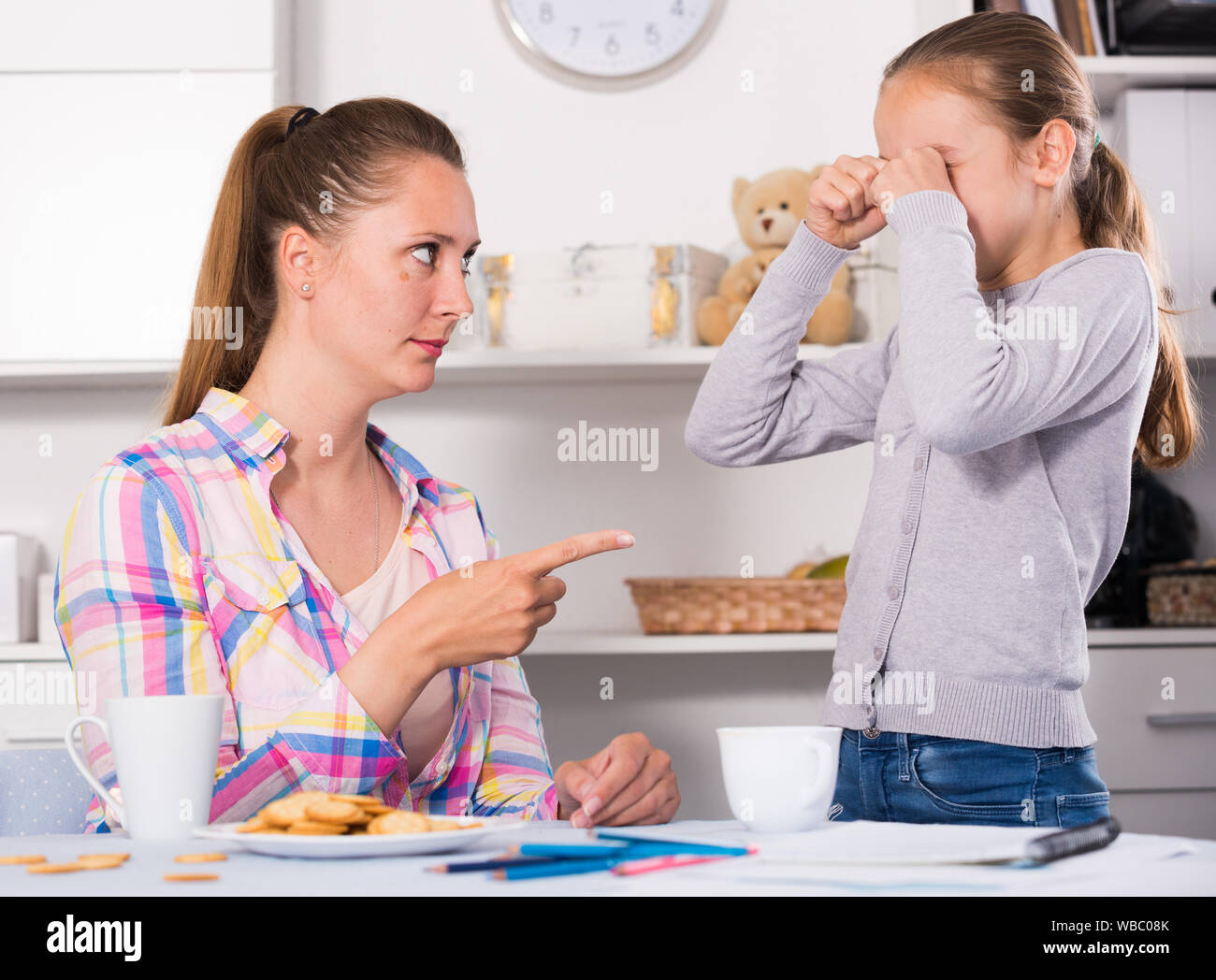 Young mother scolding her daughter for bad behavior and mistakes Stock Photo - Alamy