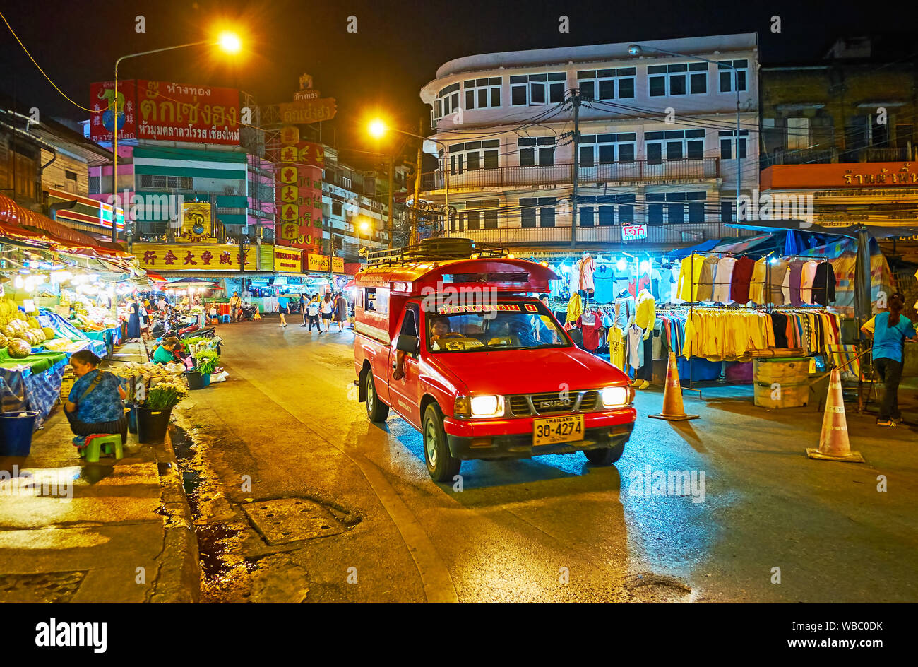 CHIANG MAI, THAILAND - MAY 2, 2019: The songtaew red pickup taxi drives ...
