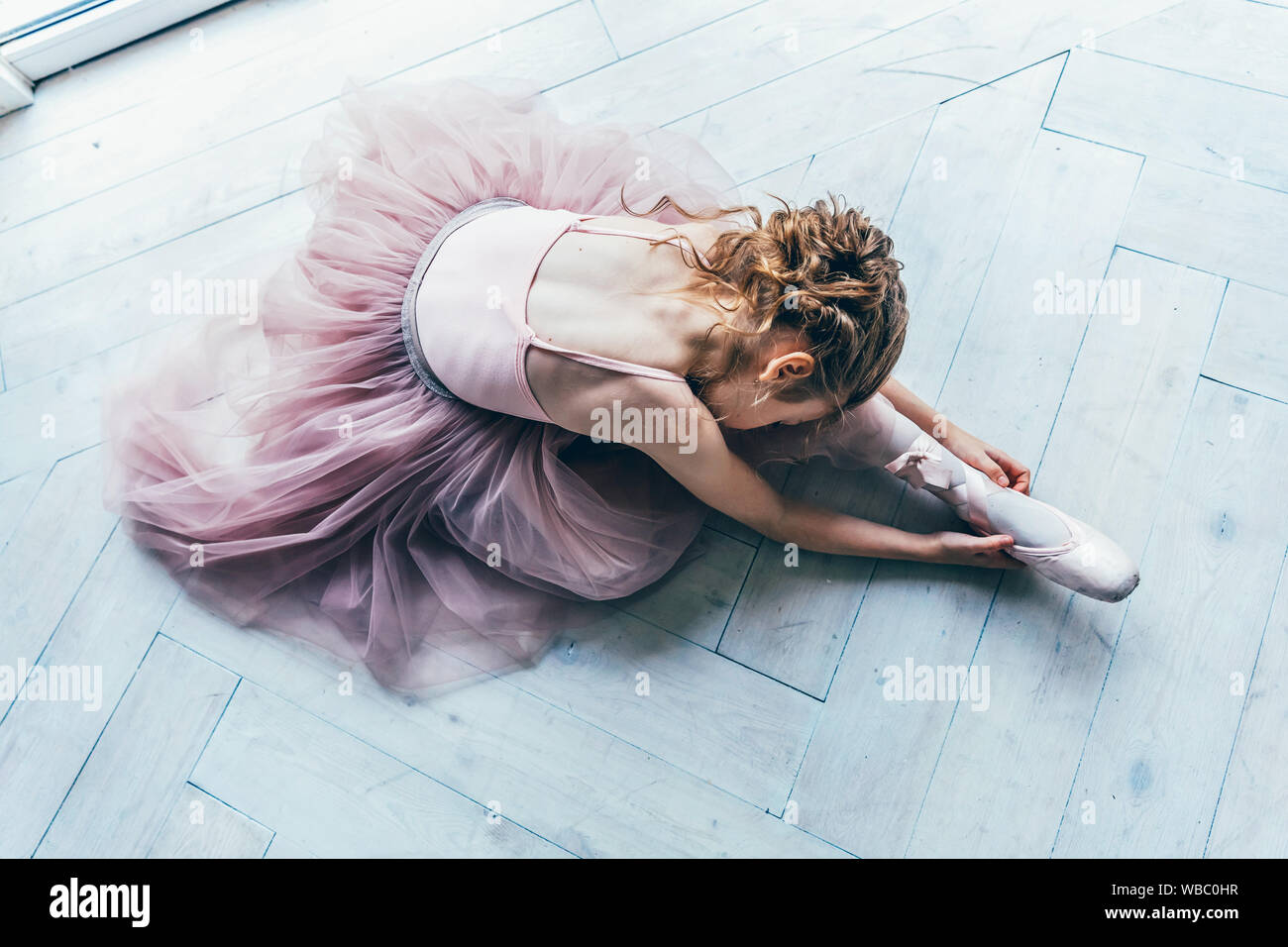 Young classical ballet dancer girl in dance class. Beautiful graceful ...