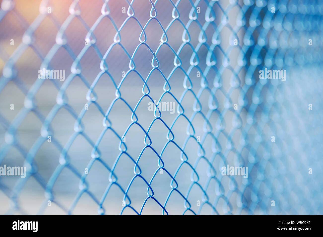 Steel mesh netting with blue polymer coating, close-up Stock Photo - Alamy