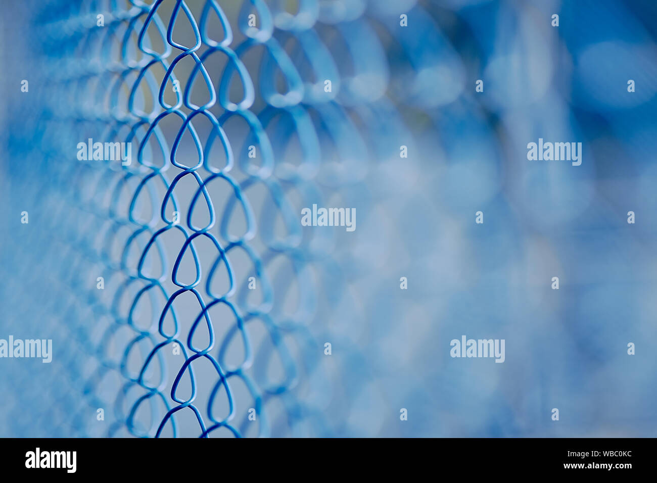Steel mesh netting with blue polymer coating, close-up Stock Photo - Alamy