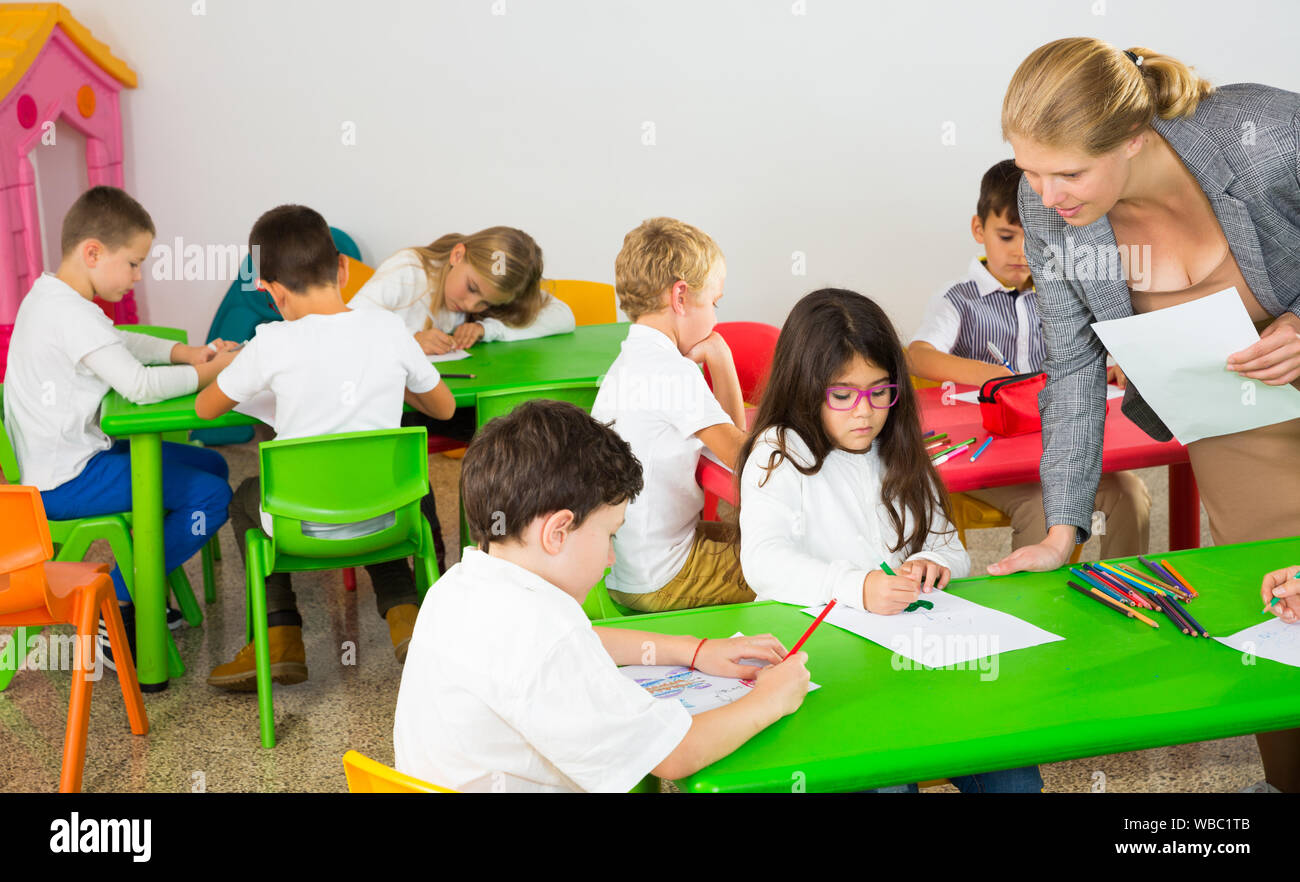 Junior age child working in the school classroom hi-res stock ...