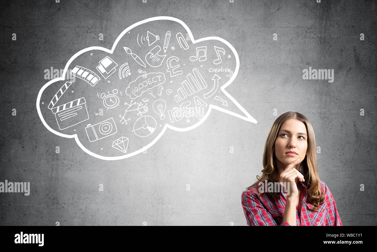 Serious woman looks pensive upwards and thinking something. Speech ...
