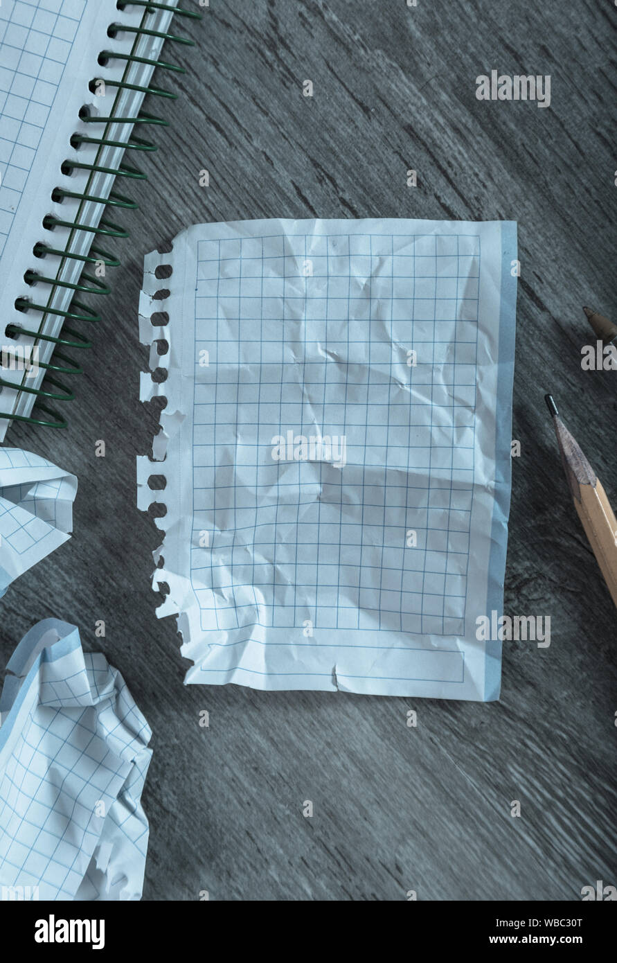 Empty crumpled pages from notebook lying on wooden surface Stock Photo ...
