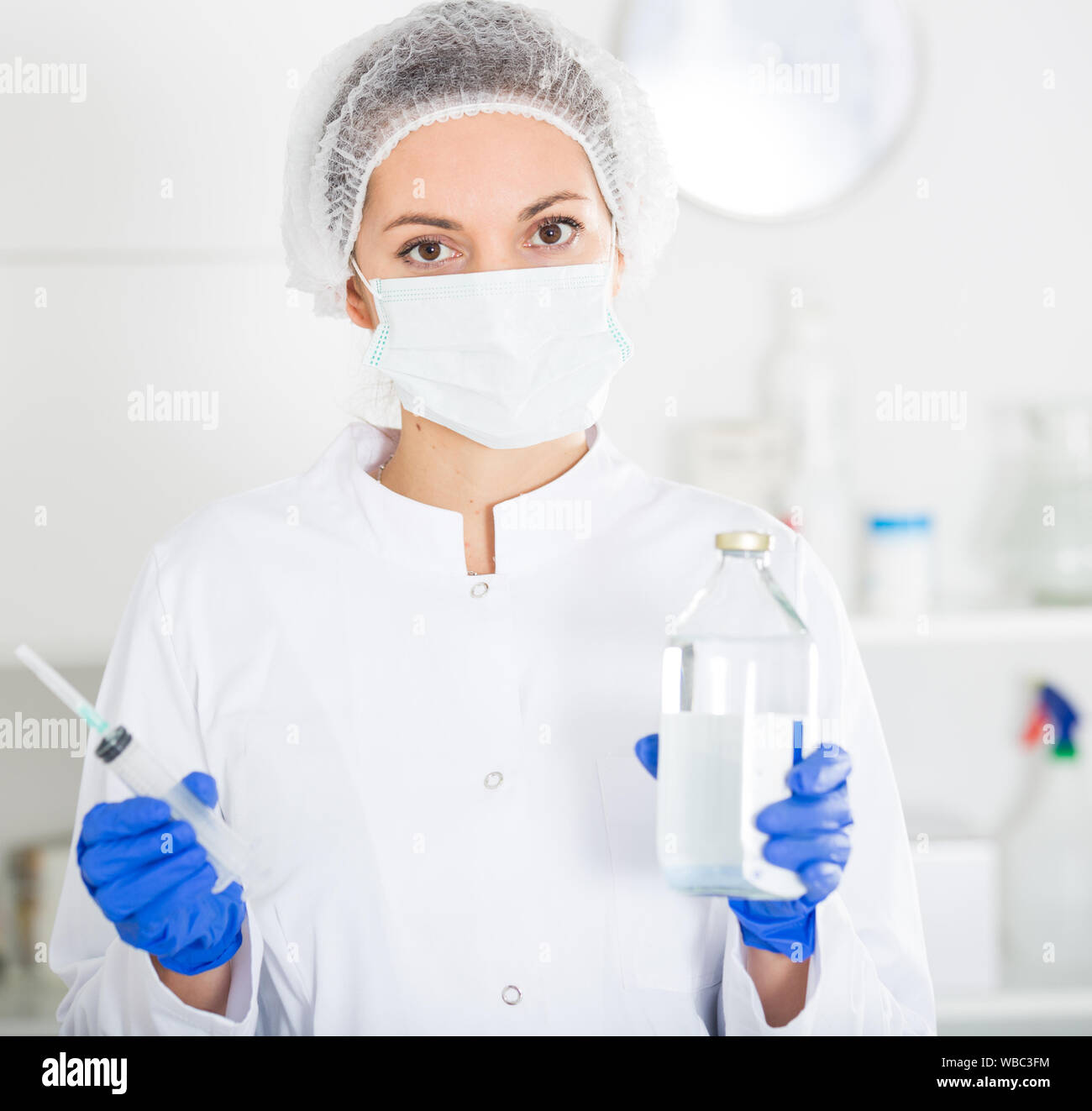 Young female nurse ready to make injection in hospital Stock Photo - Alamy