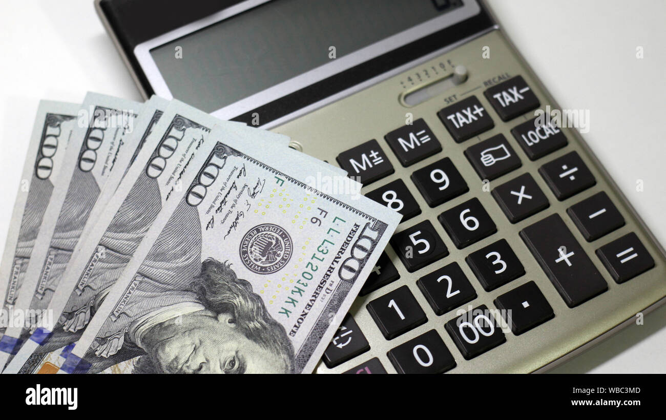 Cash of hundred dollar bills. A pile of one hundred US banknotes .100 ...
