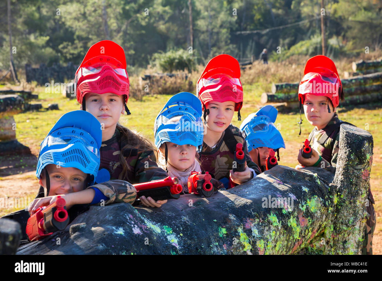 Group children playing outdoors weapon hi-res stock photography and ...