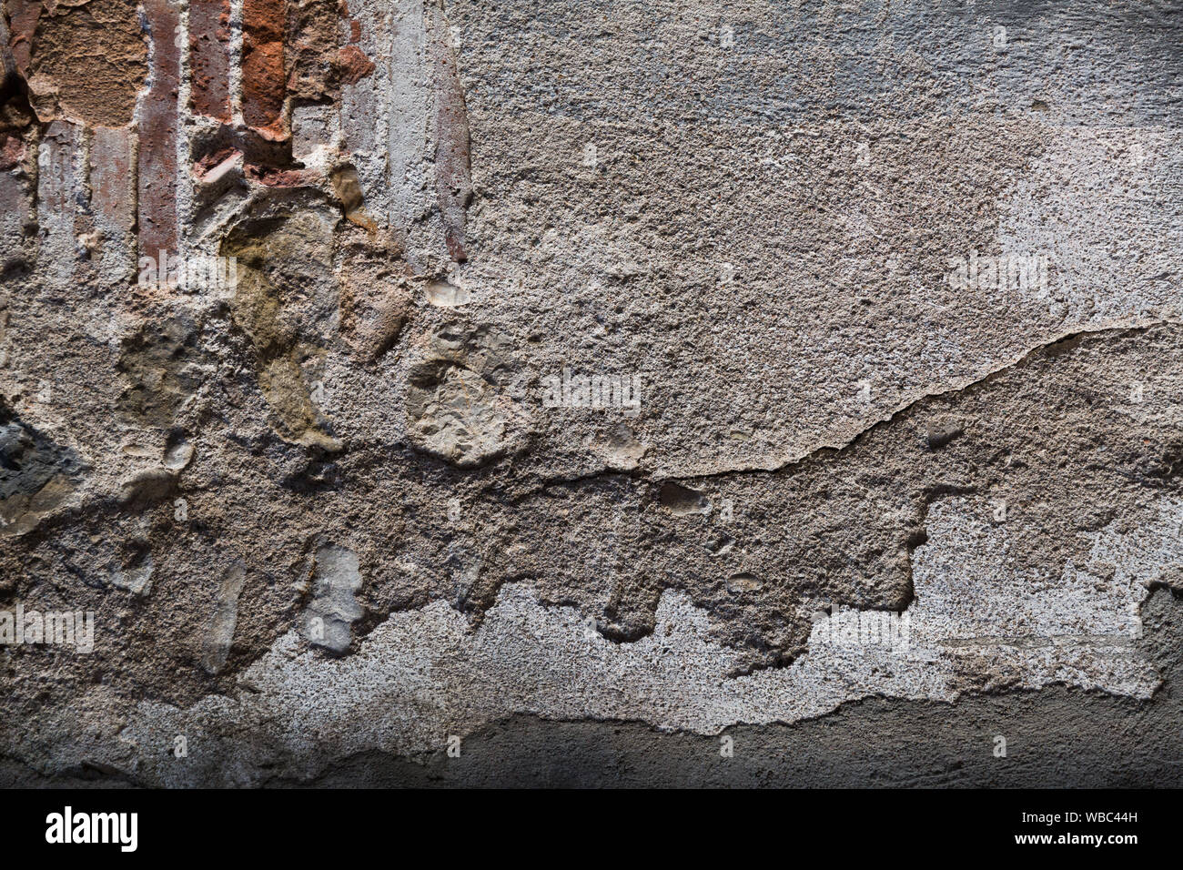 Old damaged stone wall surface texture Stock Photo - Alamy
