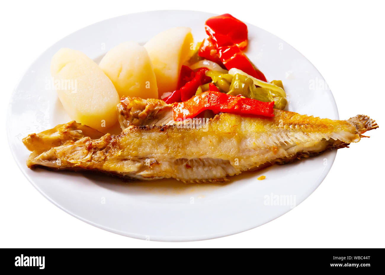 Dish of spanish cuisine – roasted maragota fish (ballan wrasse) with ...