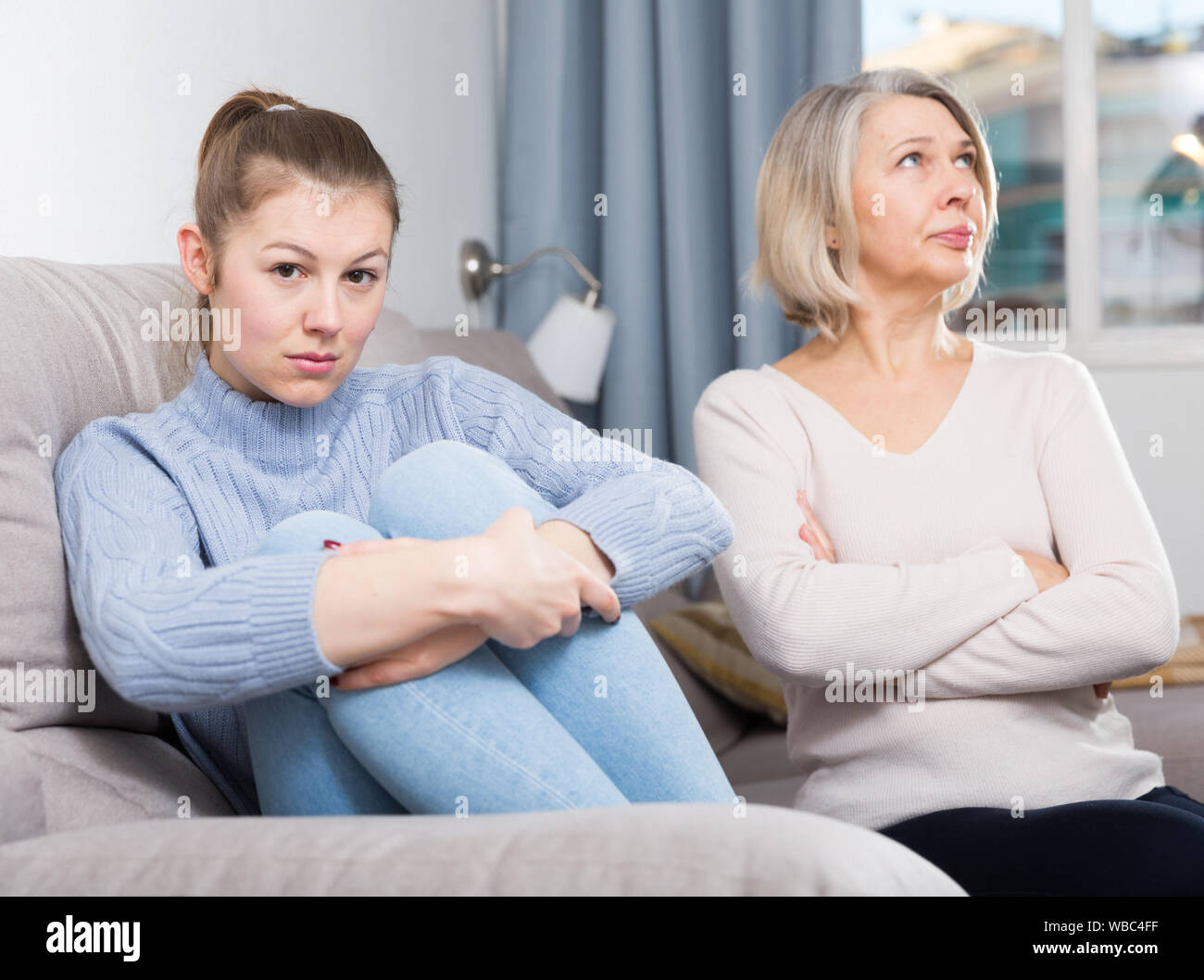 Silent resentment between mom and adult daughter Stock Photo - Alamy
