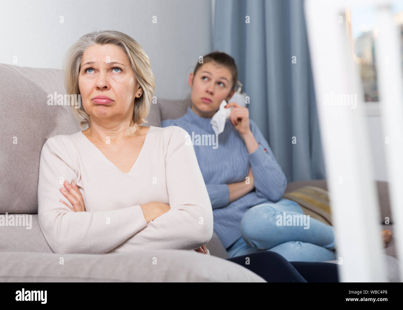 Silent resentment between mom and adult daughter Stock Photo - Alamy