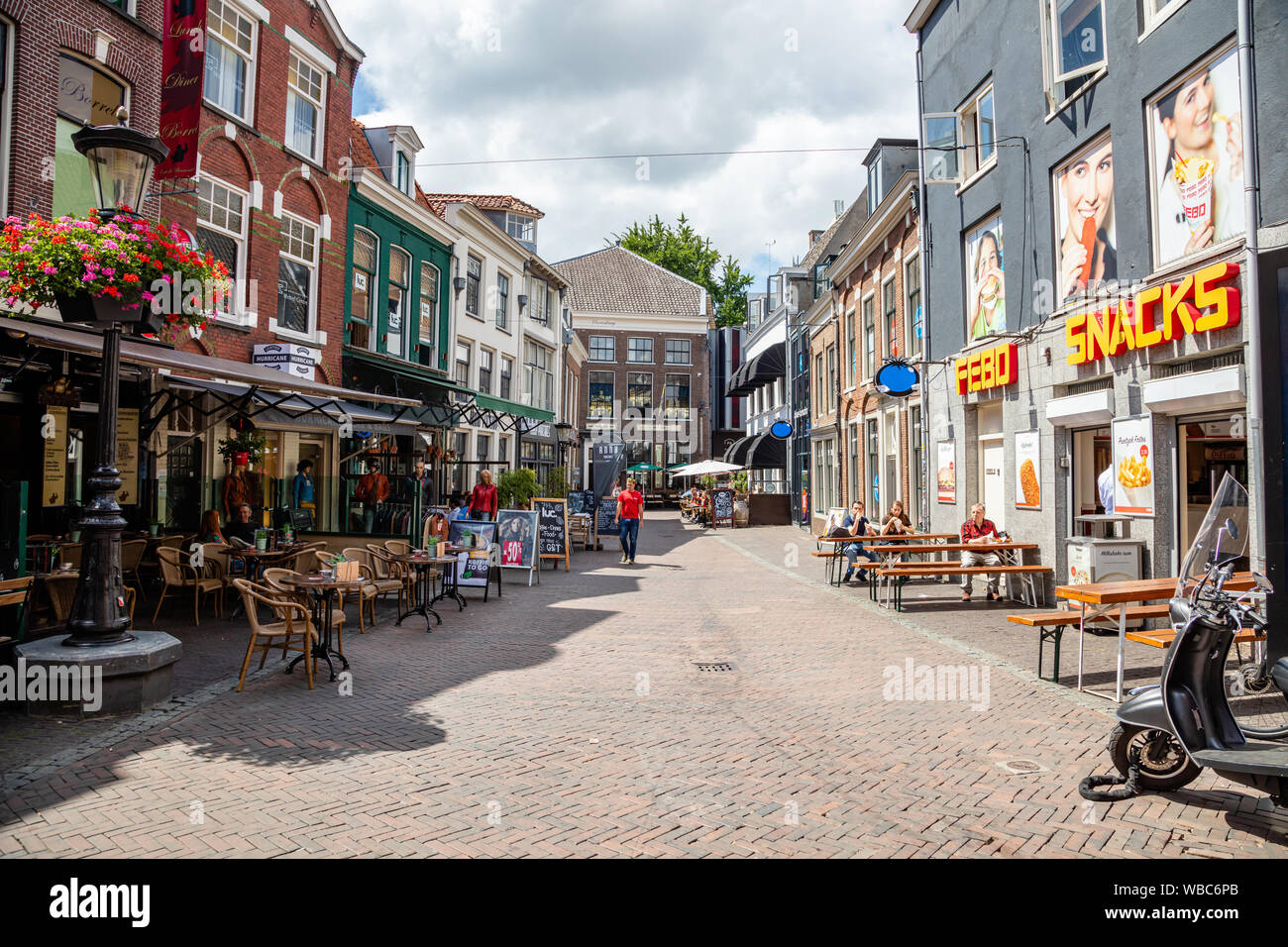 Utrecht, Netherlands - JULY 01, 2019: People walking and sitting in ...