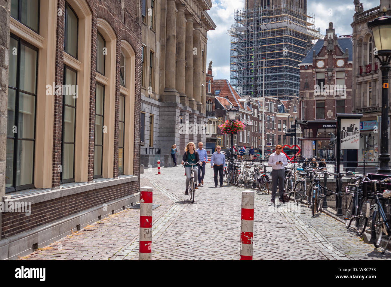 Utrecht, Netherlands - JULY 01, 2019: People walking and riding bike on ...