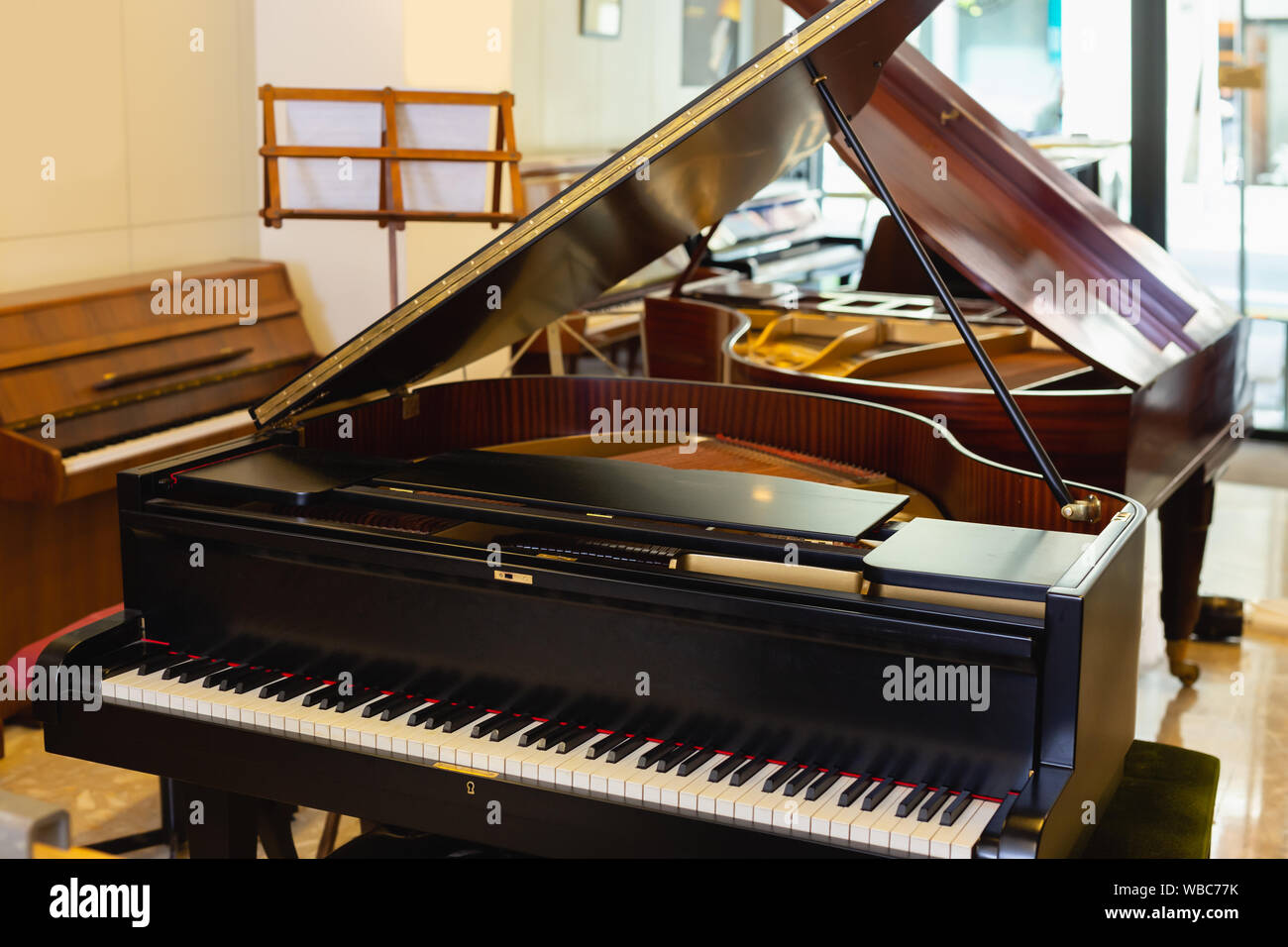 Wood vintage musical instruments in a music store Stock Photo - Alamy