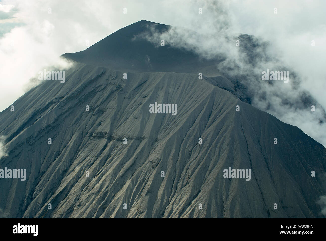 The volcano Oldoinyo Lengai, covered with a heavy fresh layer of ash ...